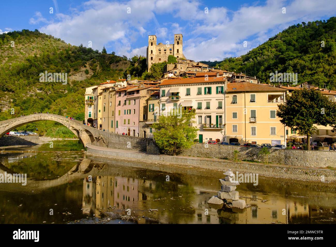Old arch bridge, Ponte Vecchio over the Nervia river with Castello di ...