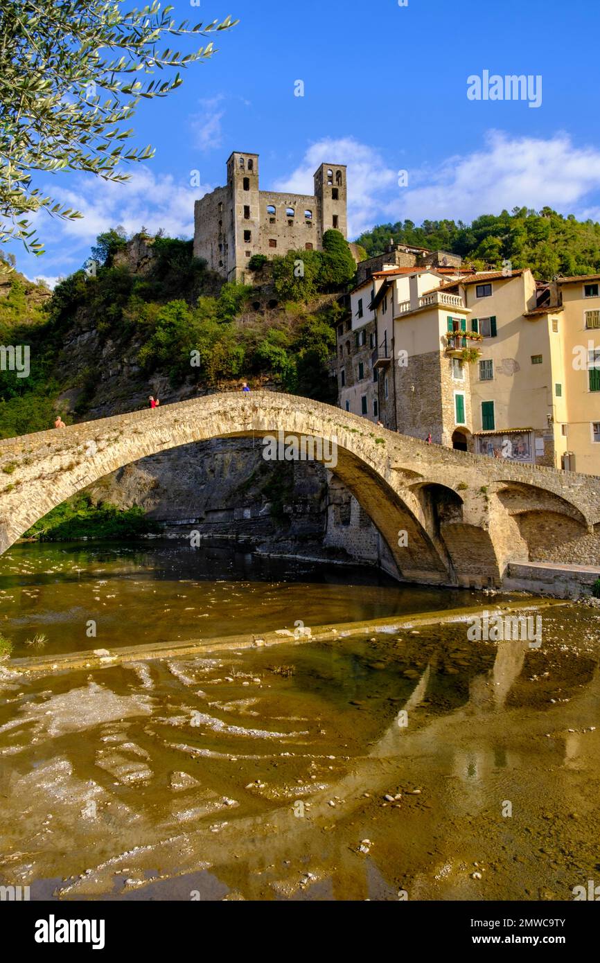Old arch bridge, Ponte Vecchio over the Nervia river with Castello di ...