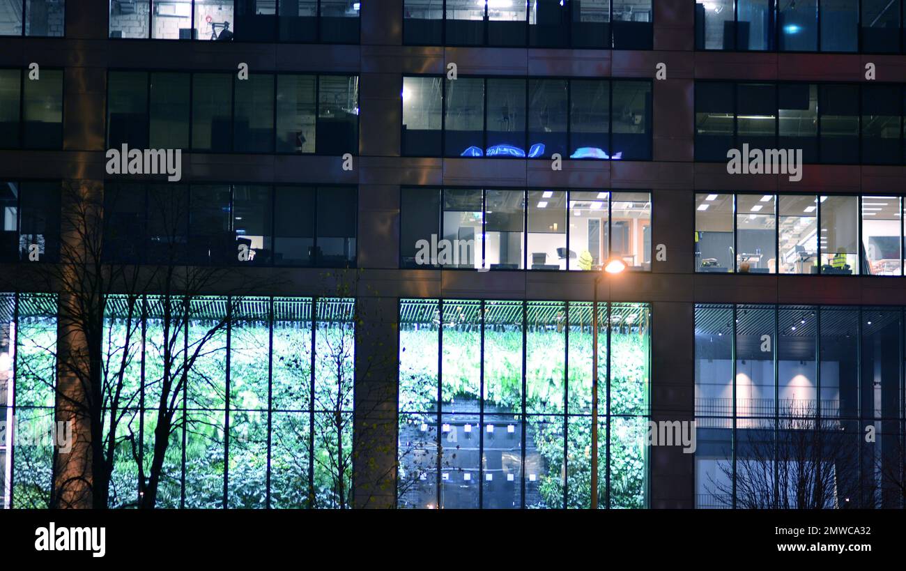 Skyscraper lobby in business district. Big glass windows in commercial ...