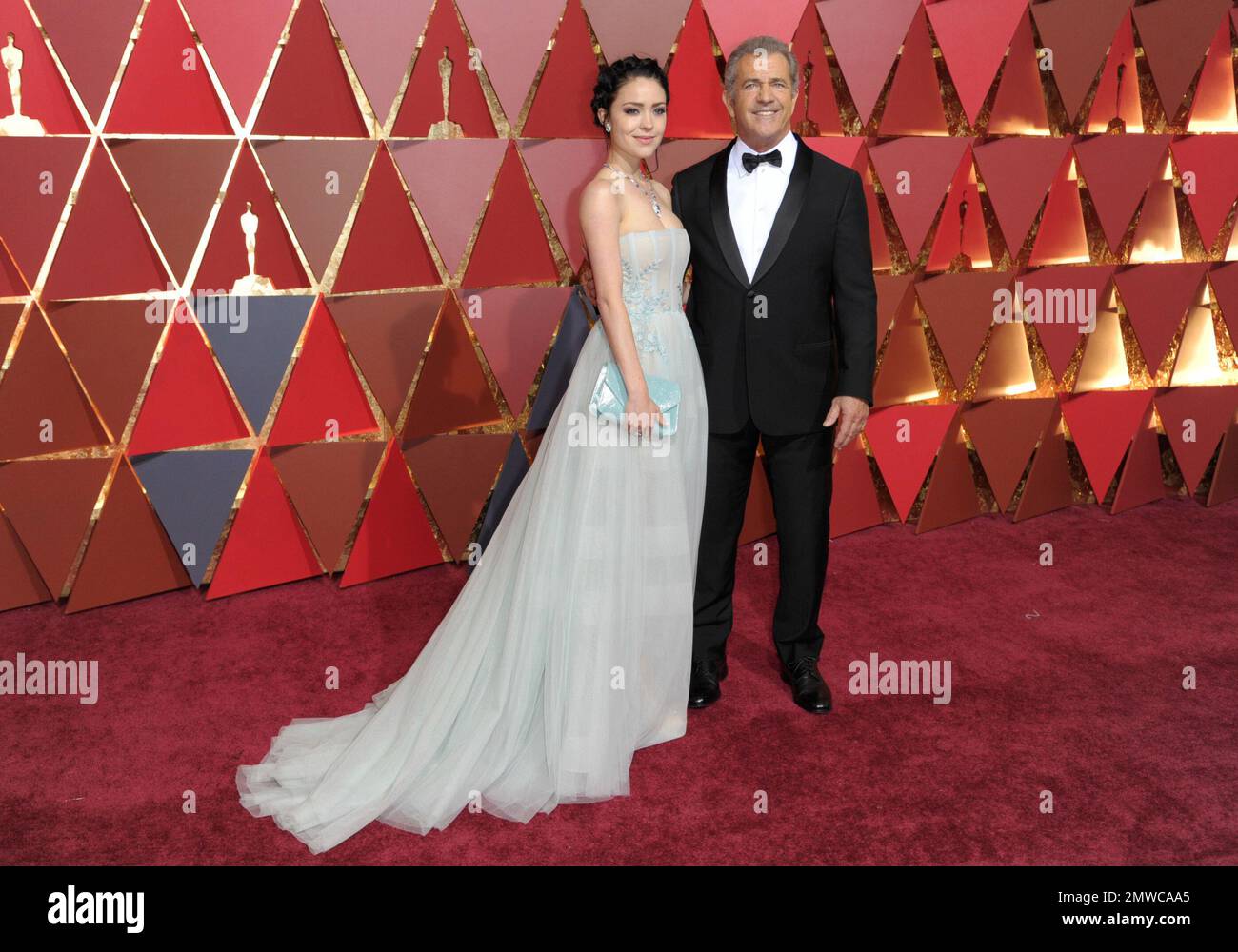 Rosalind Ross, left, and Mel Gibson arrive at the Oscars on Sunday, Feb ...