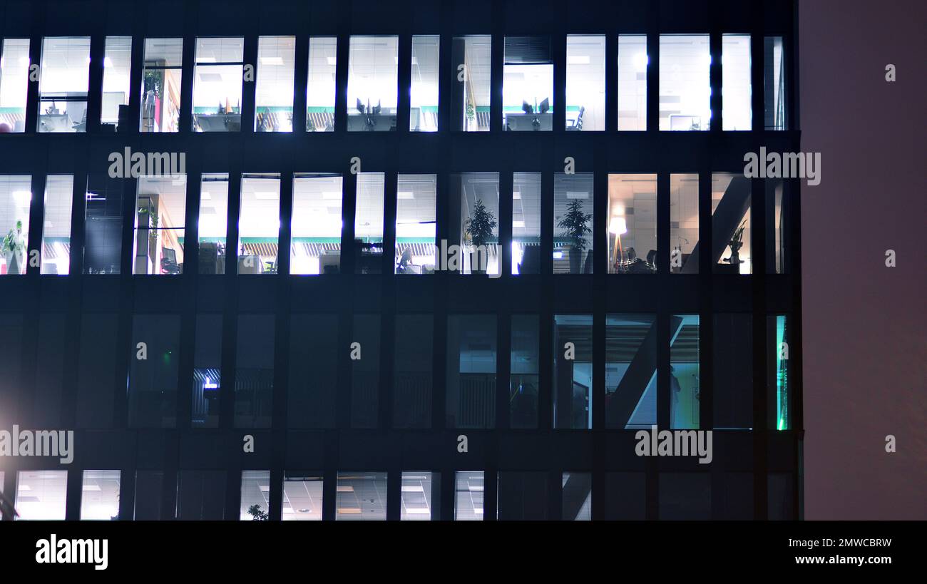 Corporate building at night - business concept. Glass wall office ...
