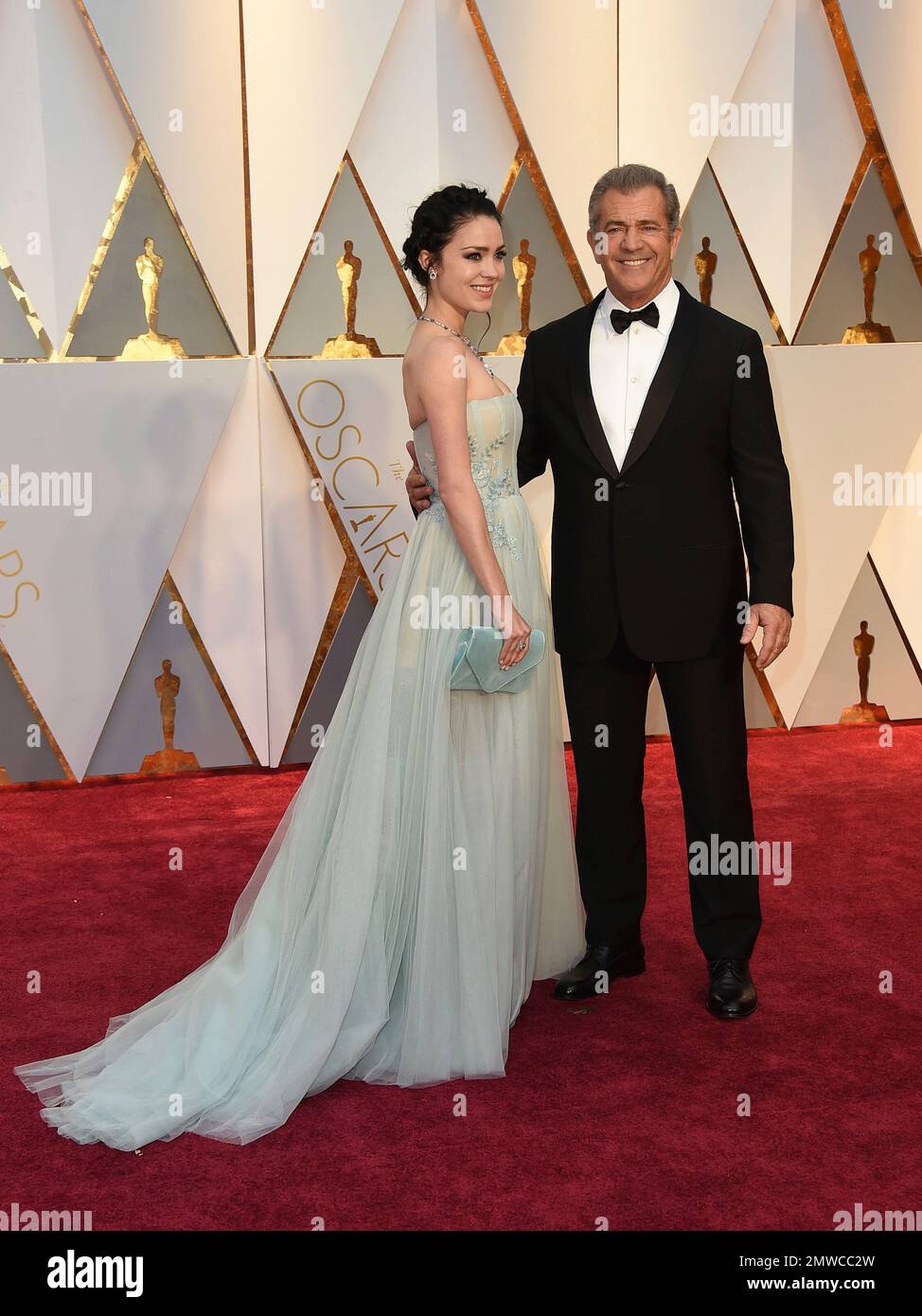 Rosalind Ross, left, and Mel Gibson arrive at the Oscars on Sunday, Feb ...