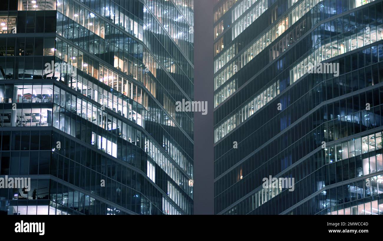 Corporate building at night - business concept. Glass wall office ...