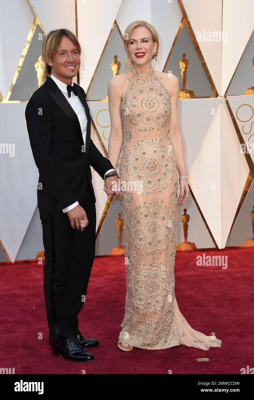 Keith Urban, left, and Nicole Kidman arrive at the Oscars on Sunday ...