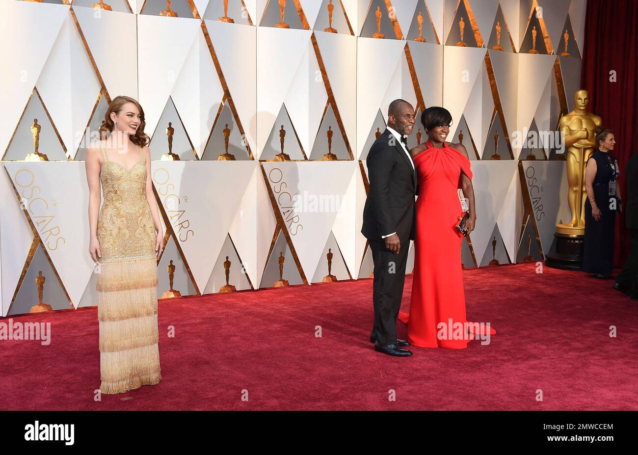 Emma Stone, from left, Julius Tennon, and Viola Davis arrive at the ...