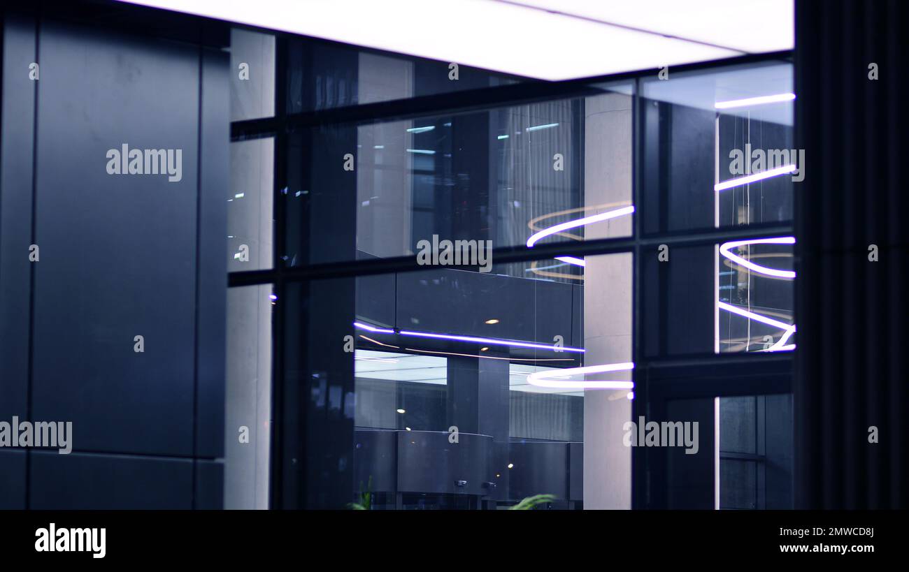 Skyscraper lobby in business district. Big glass windows in commercial ...