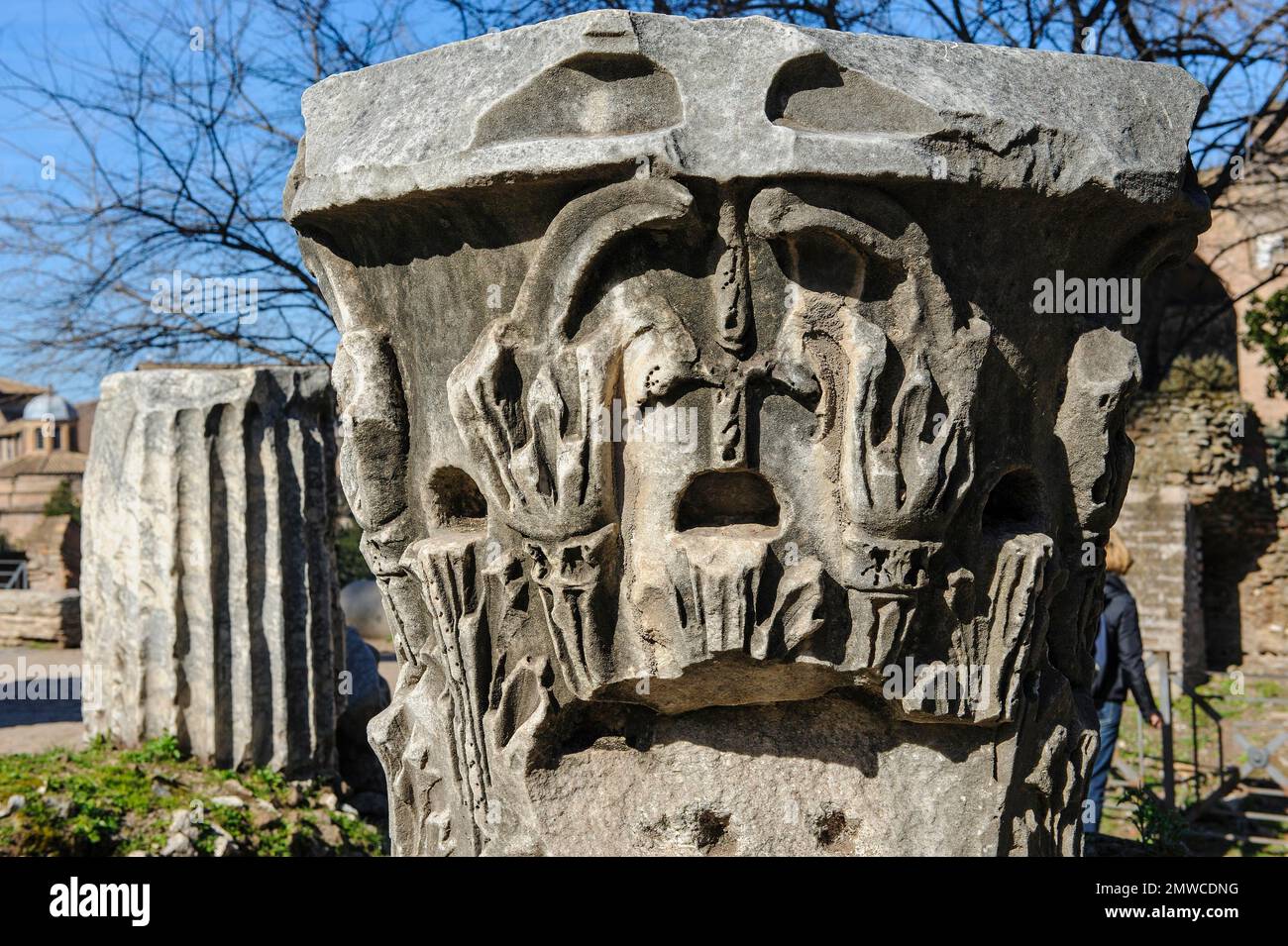 Fragment of capital of column with head with stylised cry, historical ...