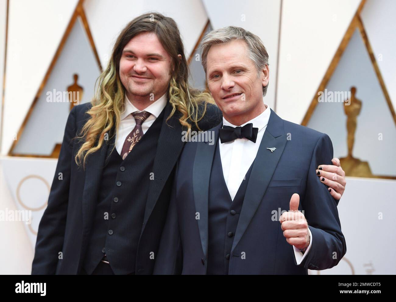 Henry Mortensen, left, and Viggo Mortensen arrive at the Oscars on ...