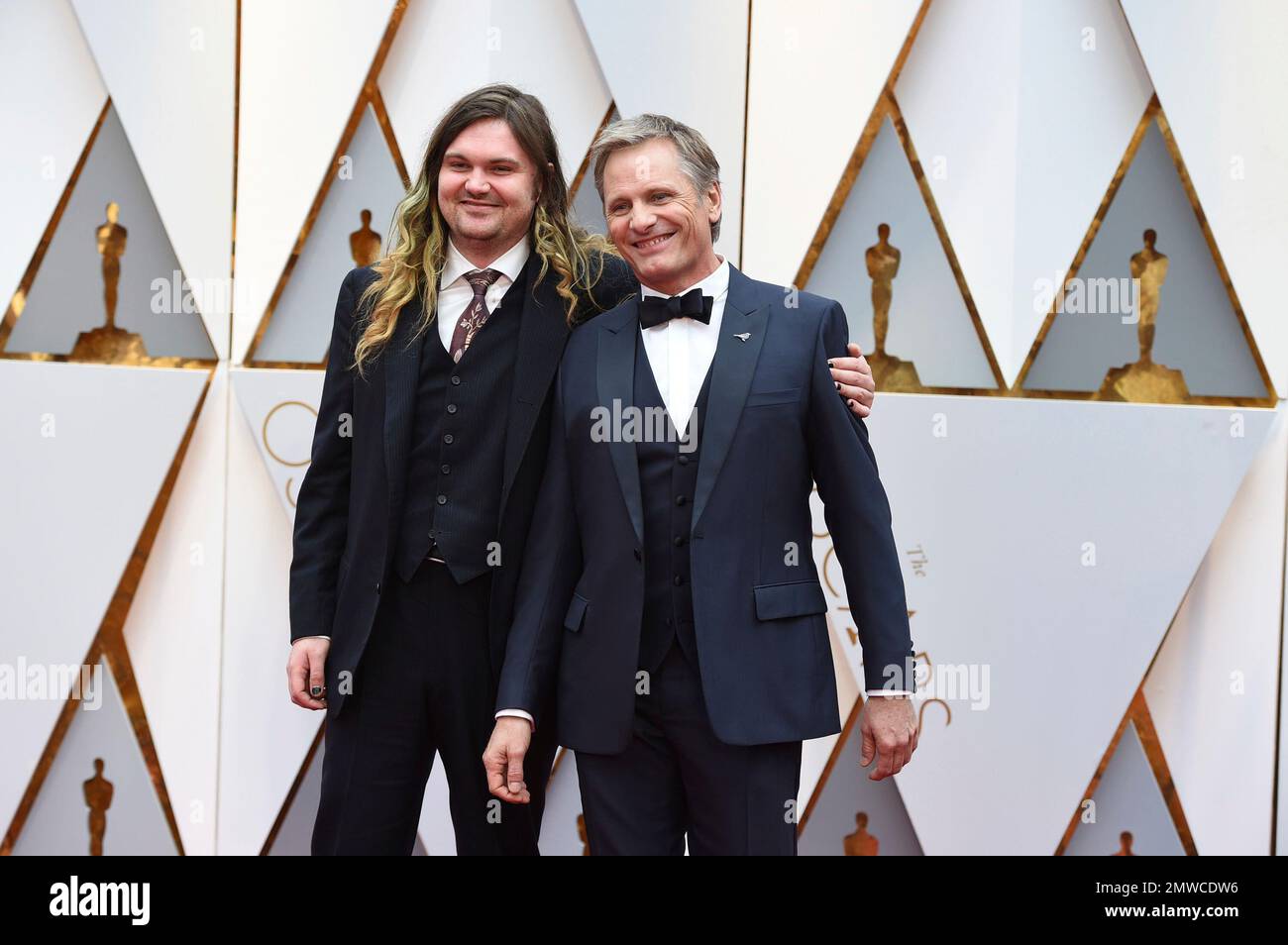 Henry Mortensen, left, and Viggo Mortensen arrive at the Oscars on ...