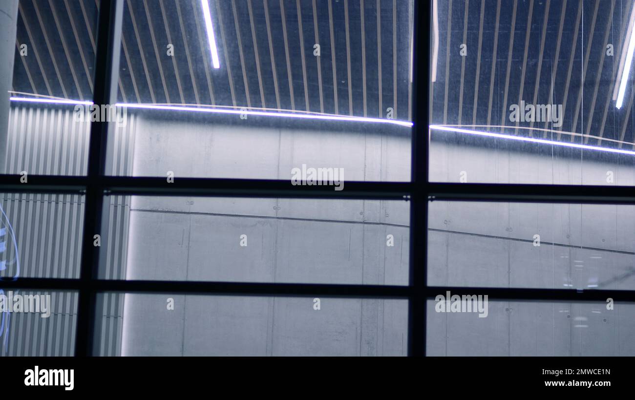 Skyscraper lobby in business district. Big glass windows in commercial ...