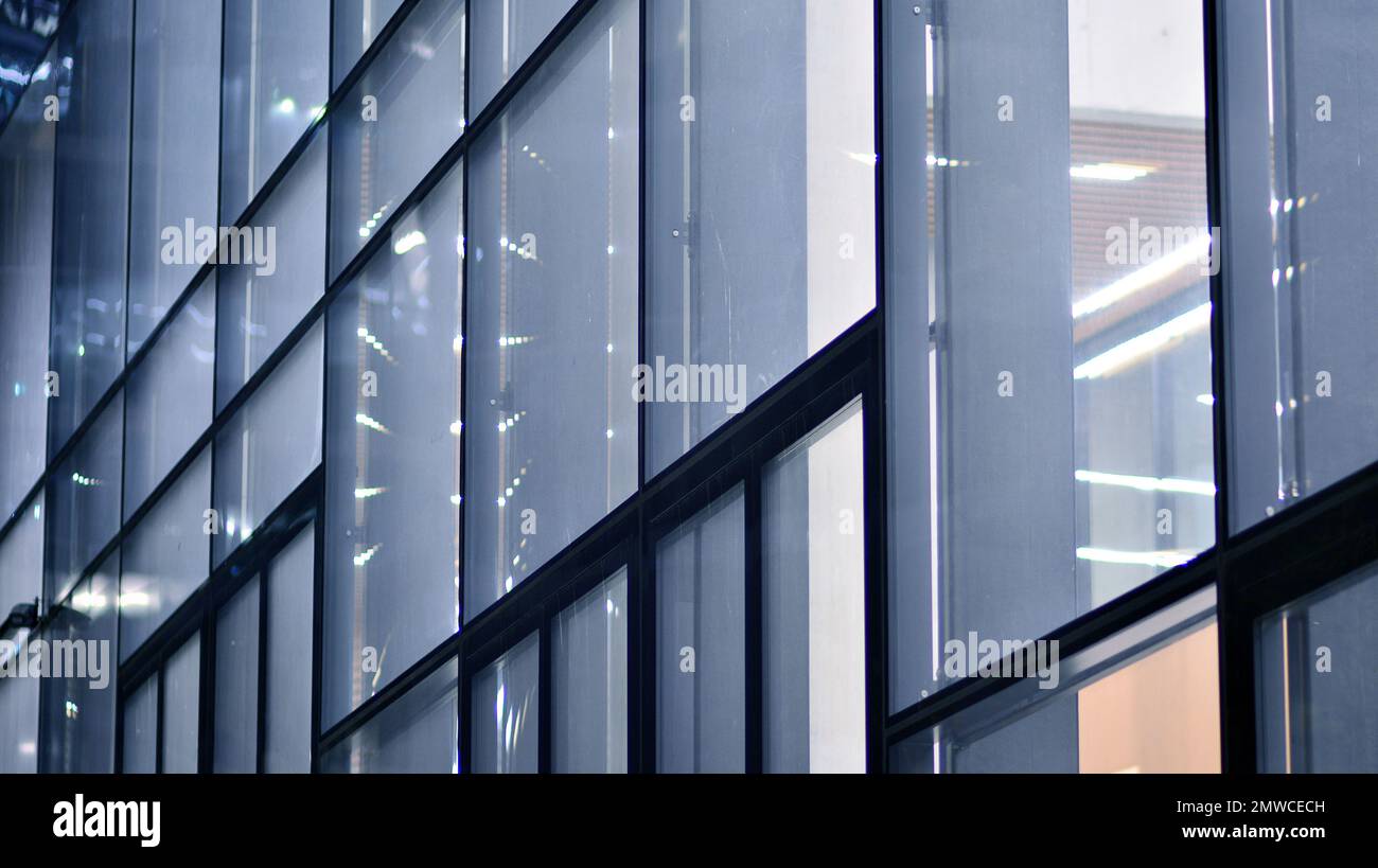 Skyscraper lobby in business district. Big glass windows in commercial ...