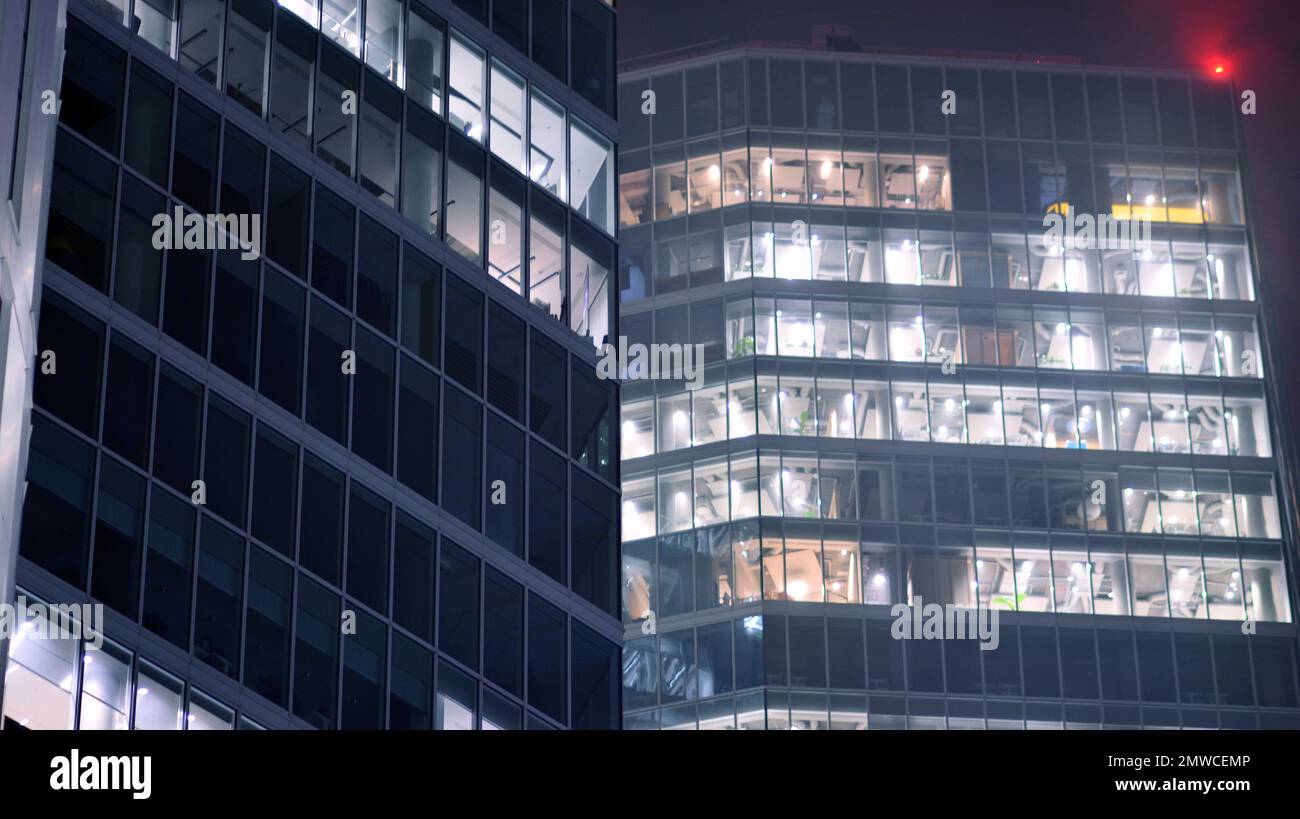 Corporate building at night - business concept. Glass wall office ...