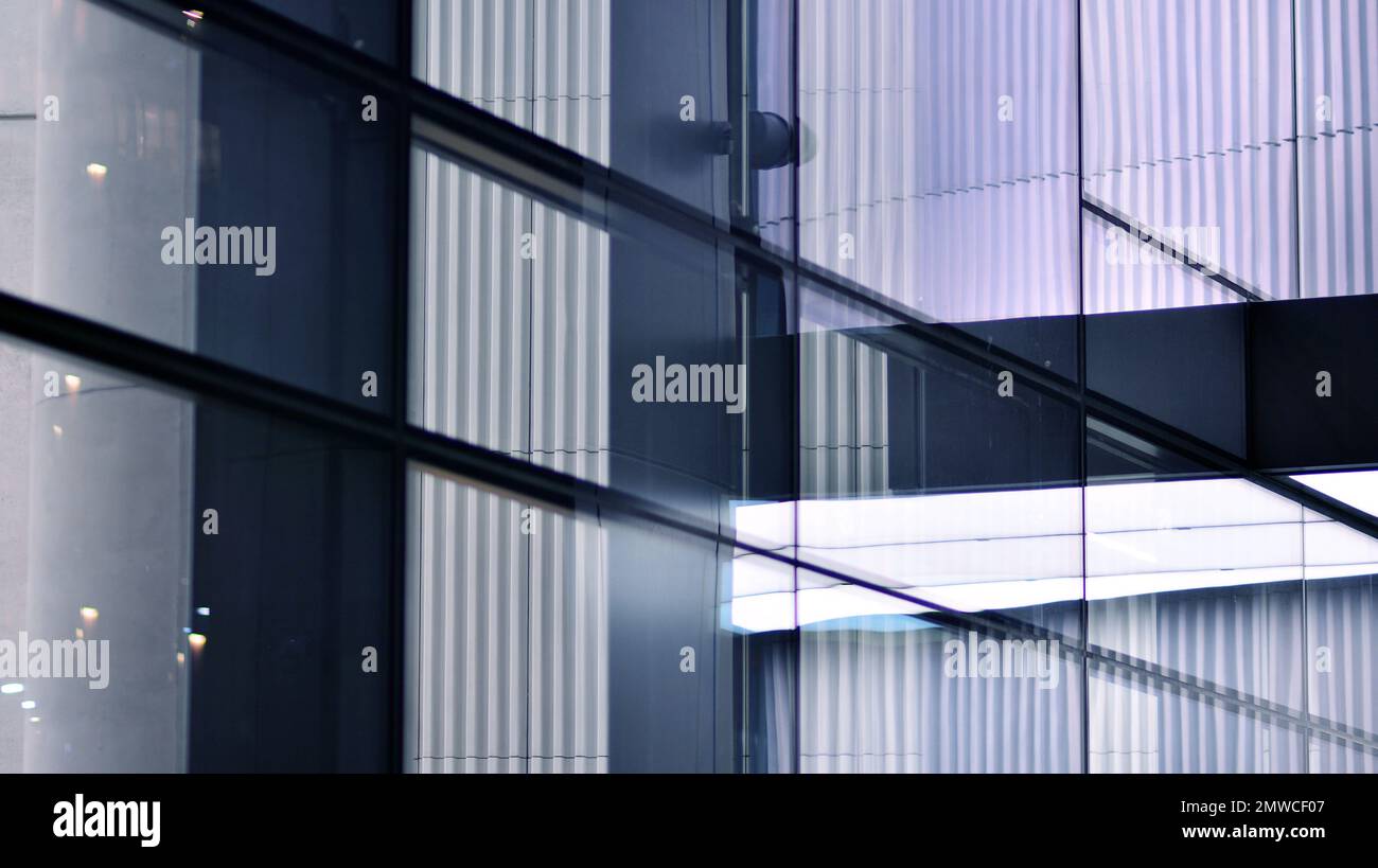 Skyscraper lobby in business district. Big glass windows in commercial ...