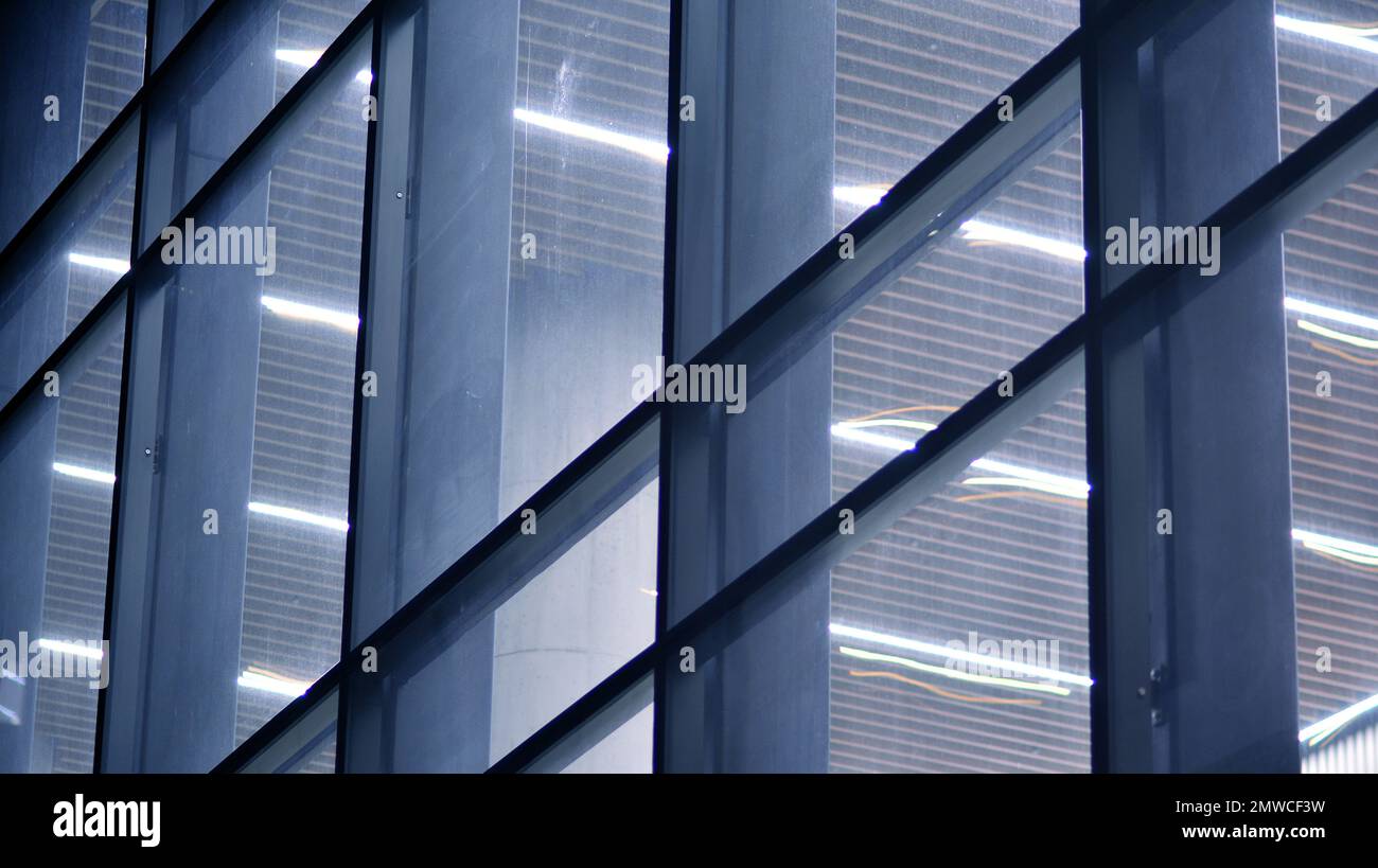 Skyscraper lobby in business district. Big glass windows in commercial ...