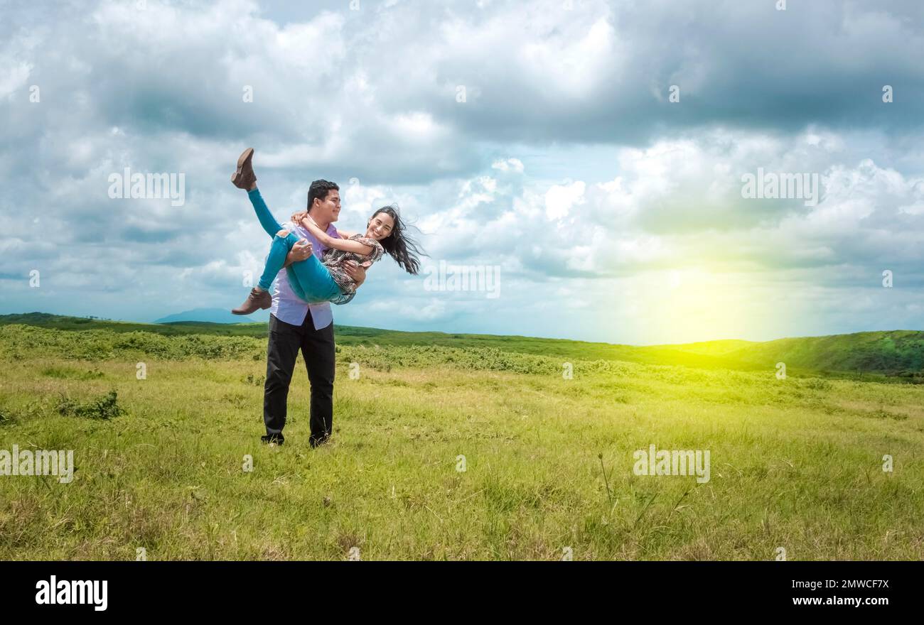 Romantic man carrying girlfriend in hi-res stock photography and images ...