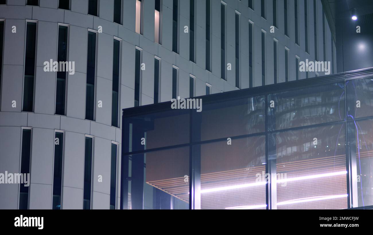 Skyscraper lobby in business district. Big glass windows in commercial ...