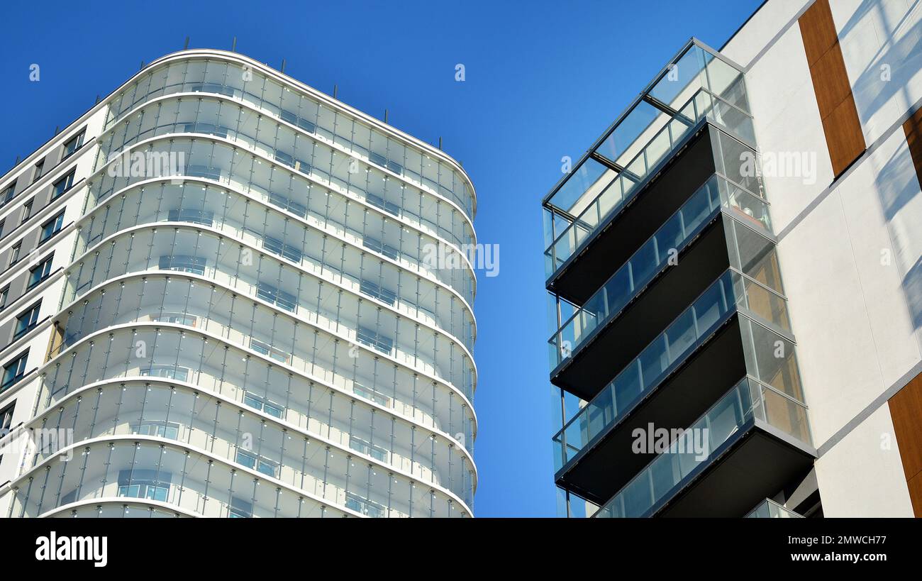 New apartment building with glass balconies. Modern architecture houses ...