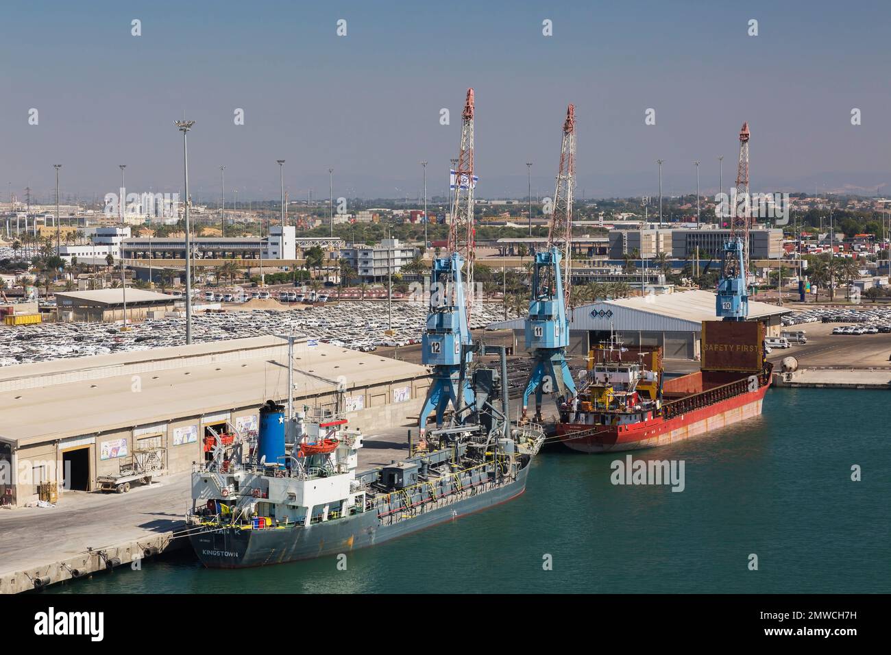 Docked Zayyan K and Von Perle cargo ships with four-link loading cranes ...