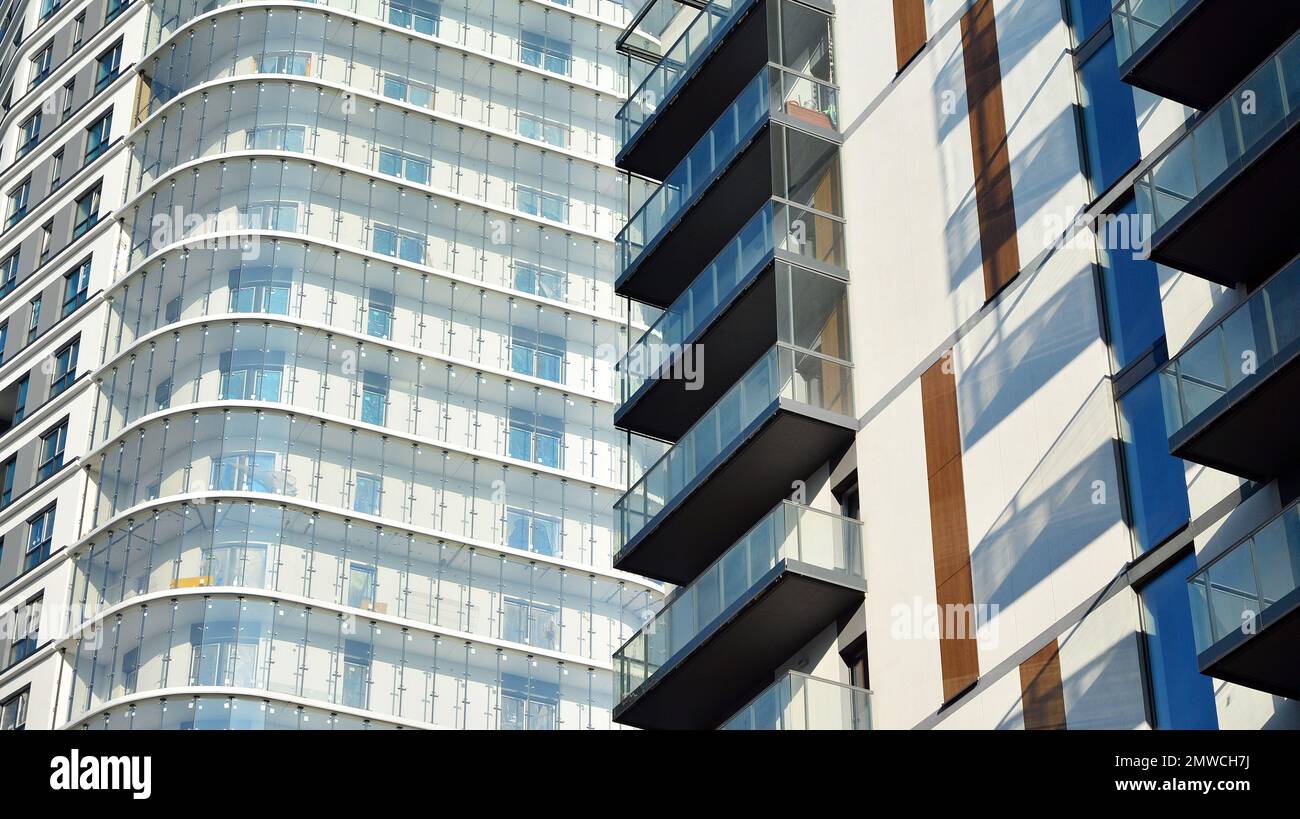 New apartment building with glass balconies. Modern architecture houses ...
