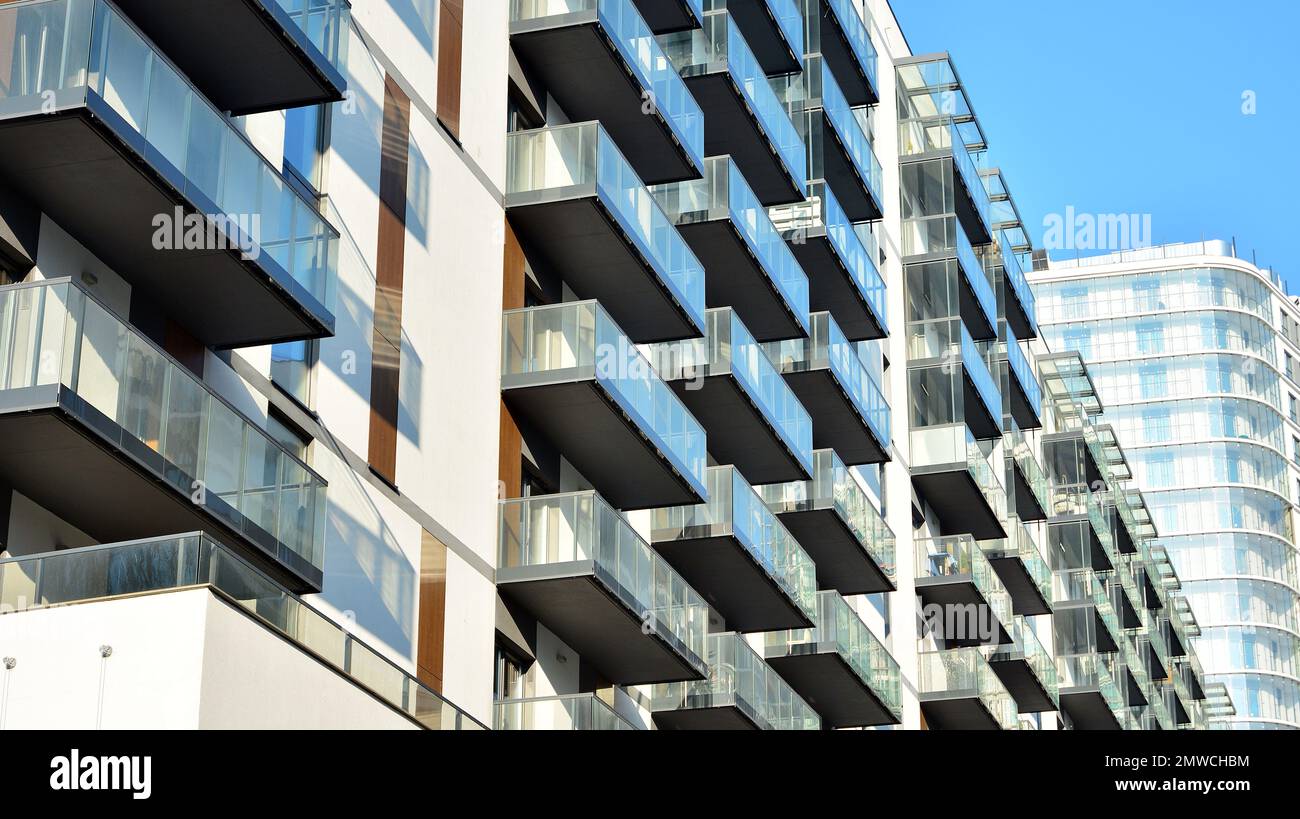 New apartment building with glass balconies. Modern architecture houses ...