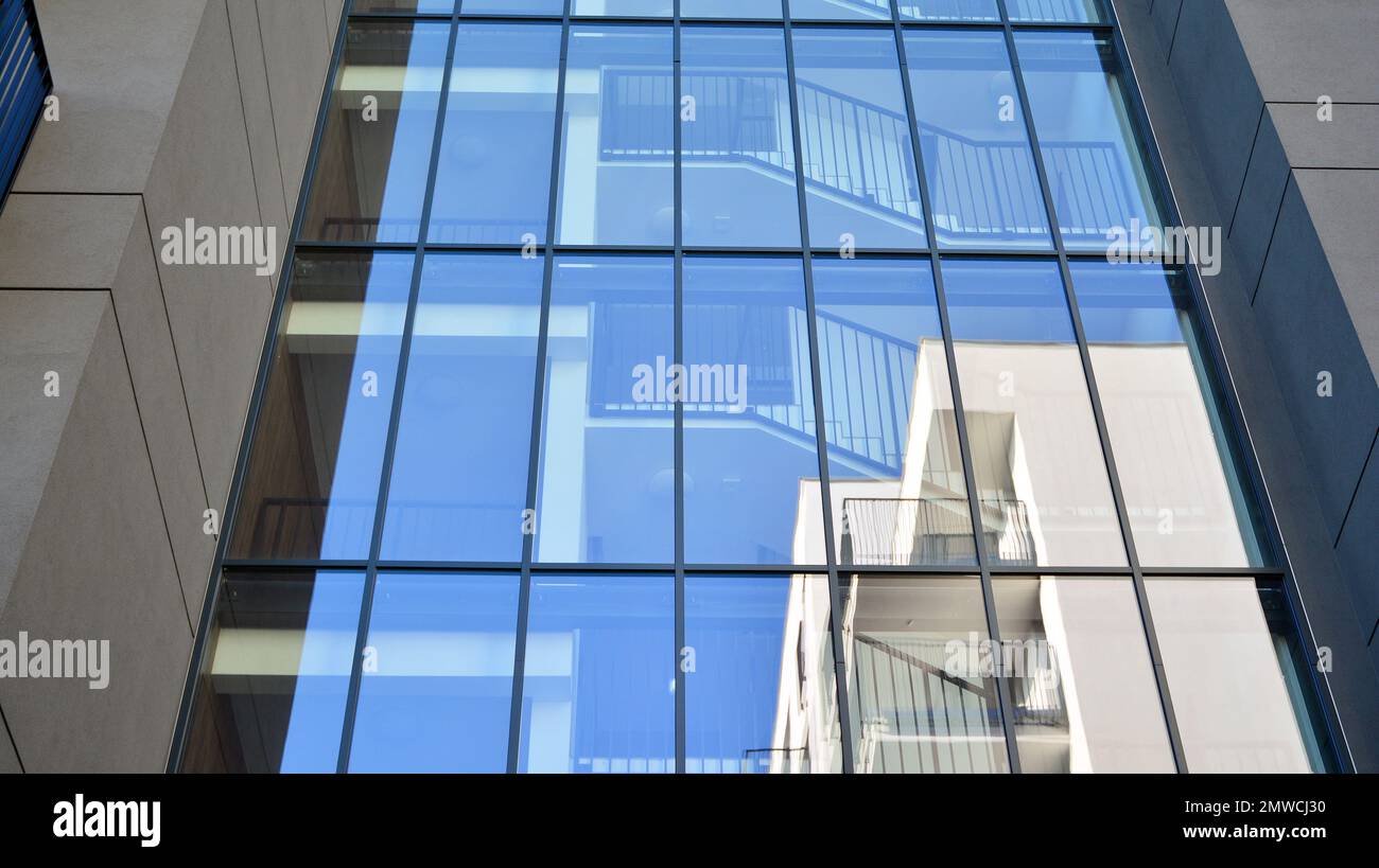 New apartment building with glass balconies. Modern architecture houses ...