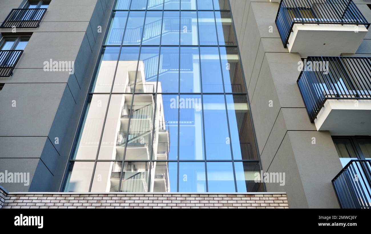 New apartment building with glass balconies. Modern architecture houses ...