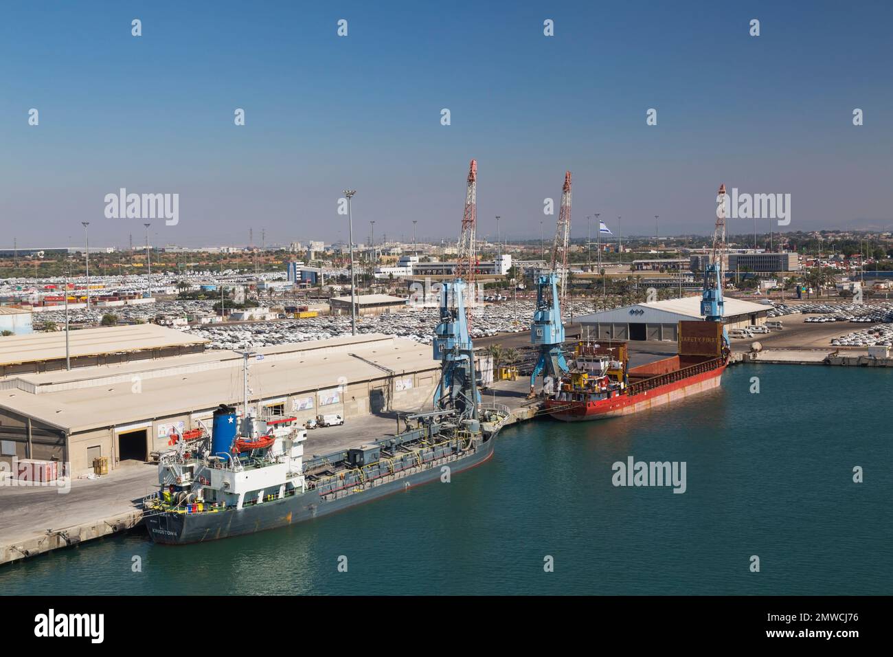 Docked Zayyan K and Von Perle cargo ships with four-link loading cranes ...