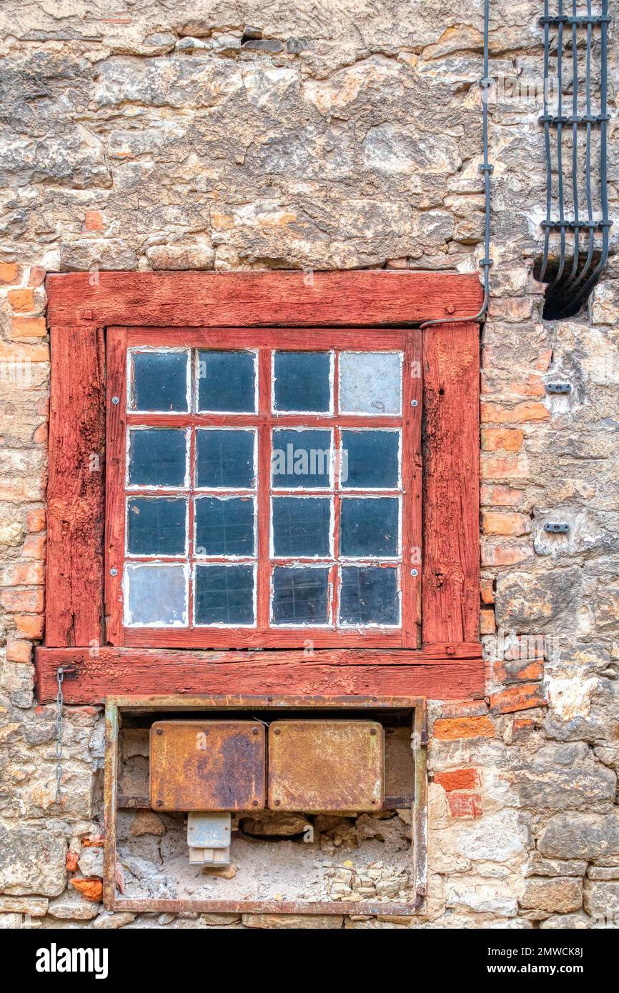 Old electrical distribution with cable routing and old gate and window ...