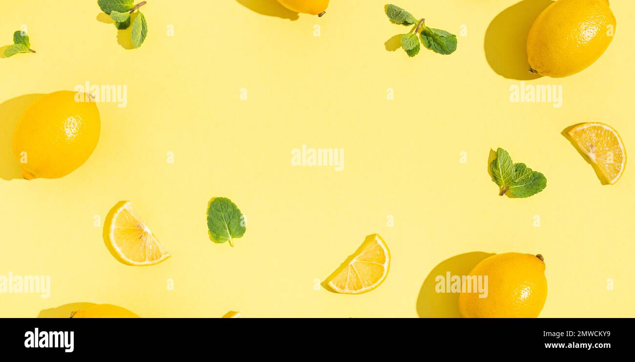 Fresh yellow lemons with mint on minimal beige yellow background on ...