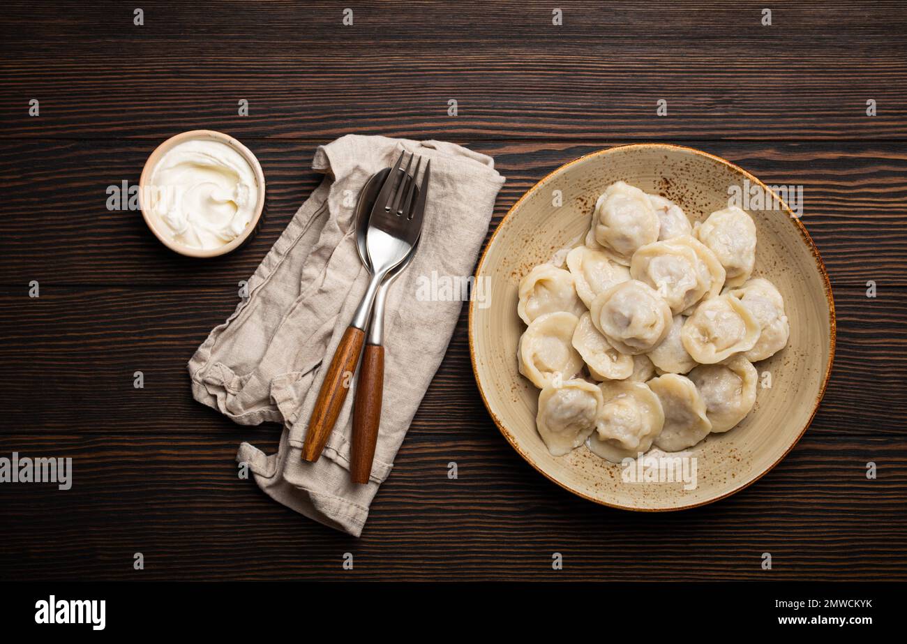 Pelmeni, traditional dish of Russian cuisine, boiled dumplings with ...