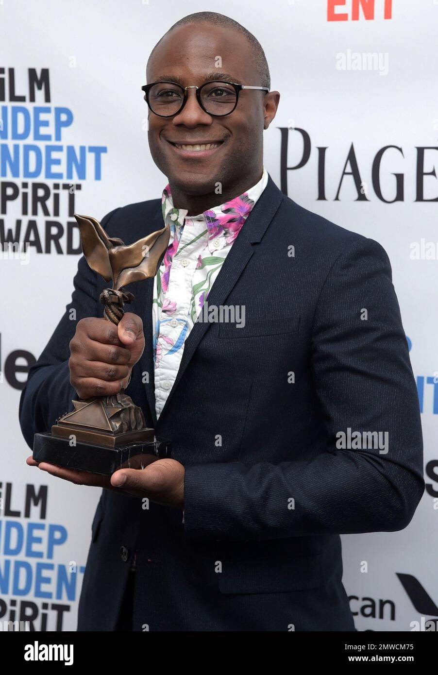 Barry Jenkins poses in the press room with the award for best feature ...