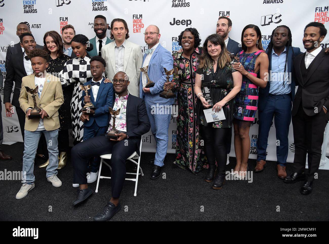 The cast and crew of "Moonlight" pose in the press room with their ...