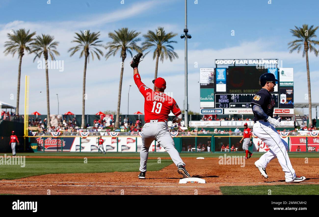 Cleveland Indians left fielder Daniel Robertson, right, beats out an ...