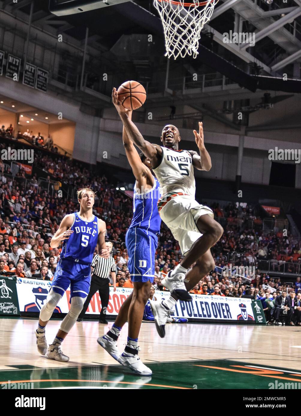Miami guard Davon Reed goes for a layup during second half action of an ...