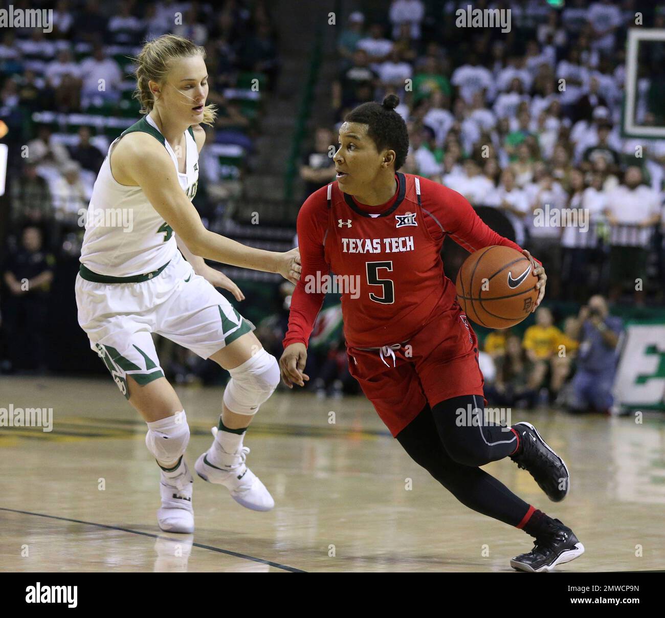 Texas Tech guard Larryn Brooks, right, drives past Baylor guard Kristy ...