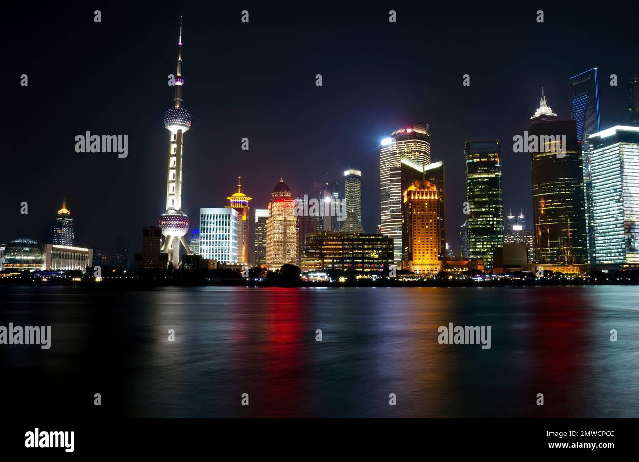 Shanghai landmark skyline at night in China with Huangpu river in ...