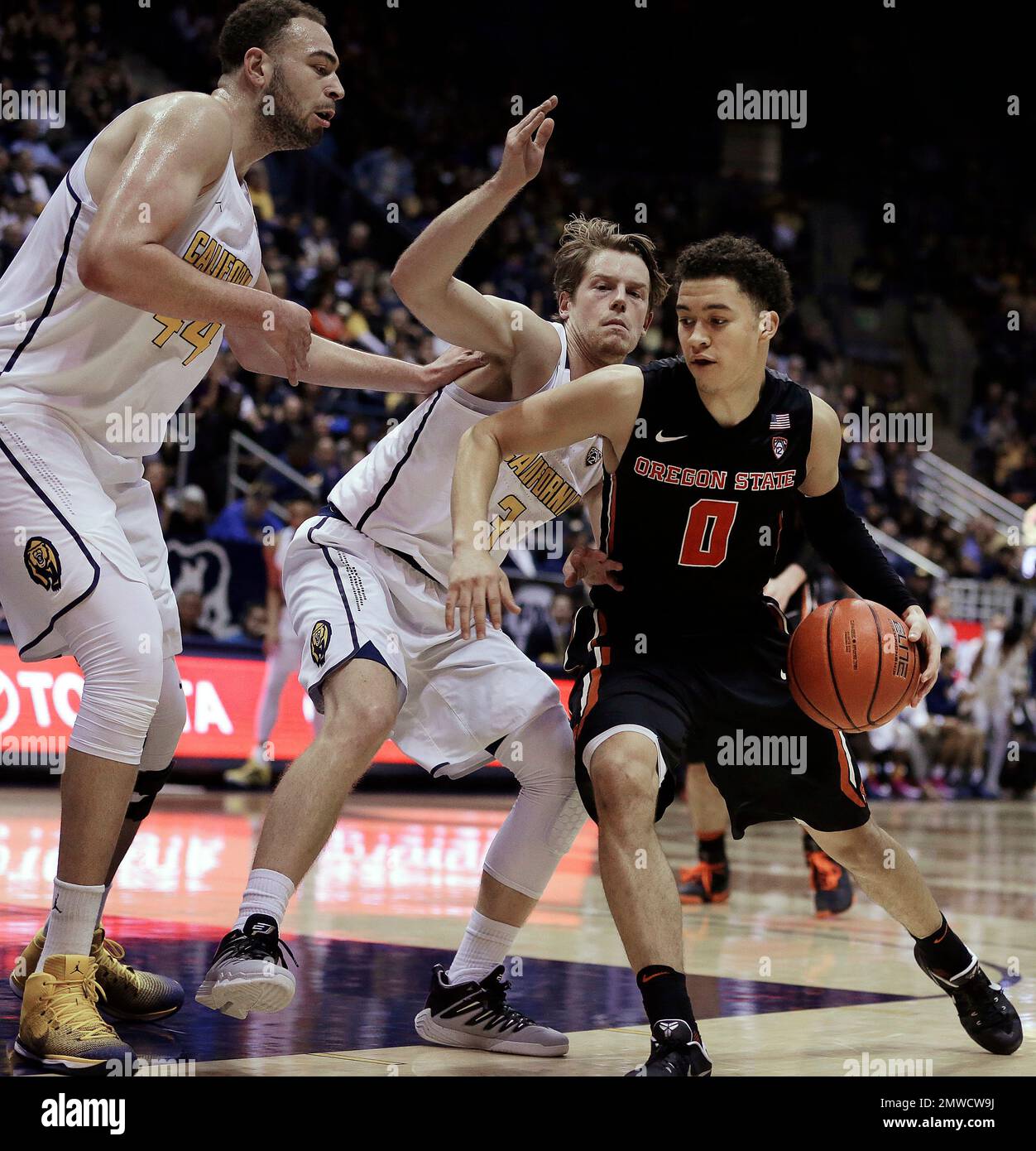 Oregon State's Jaquori McLaughlin, right, drives the ball against ...