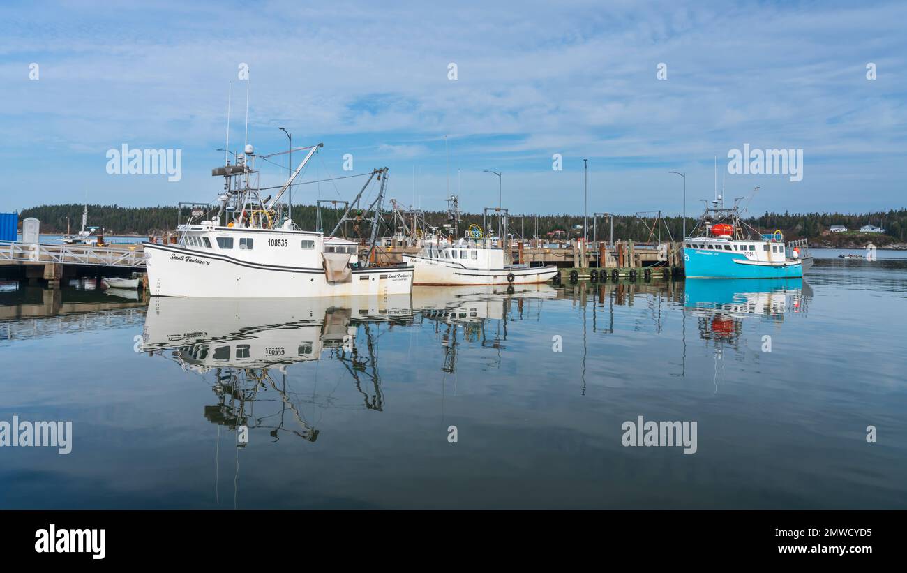 Colorful fishing boats in Dipper Harbour, New Brunswick, Canada Stock ...