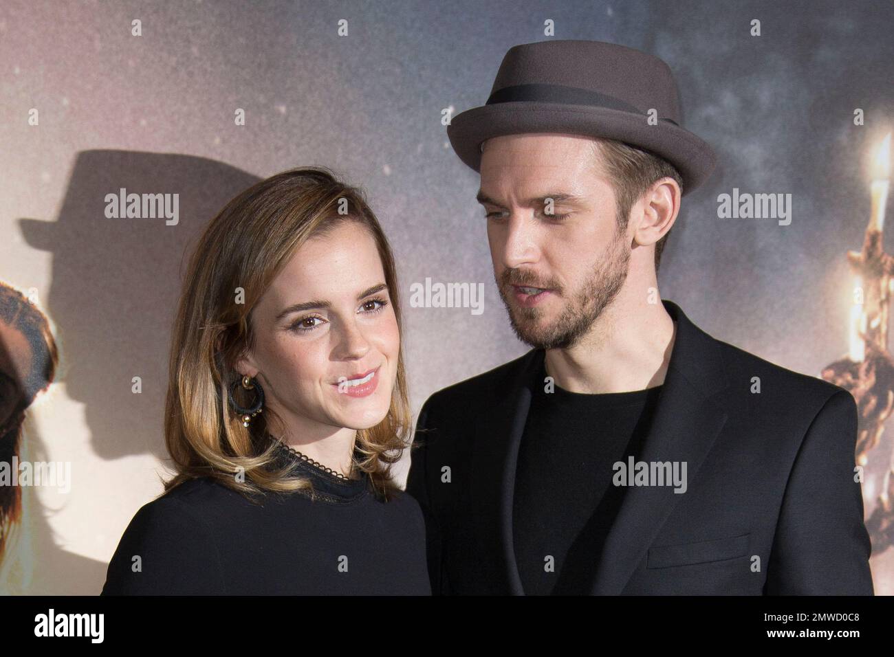 Actors Emma Watson. left, and Dan Stevens pose for photographers during ...