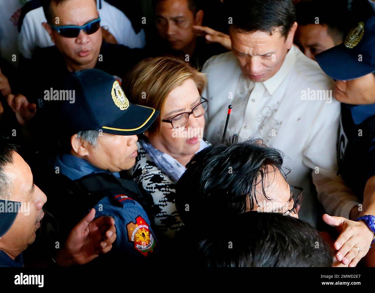 Philippine opposition Sen. Leila de Lima, center, is escorted to her ...