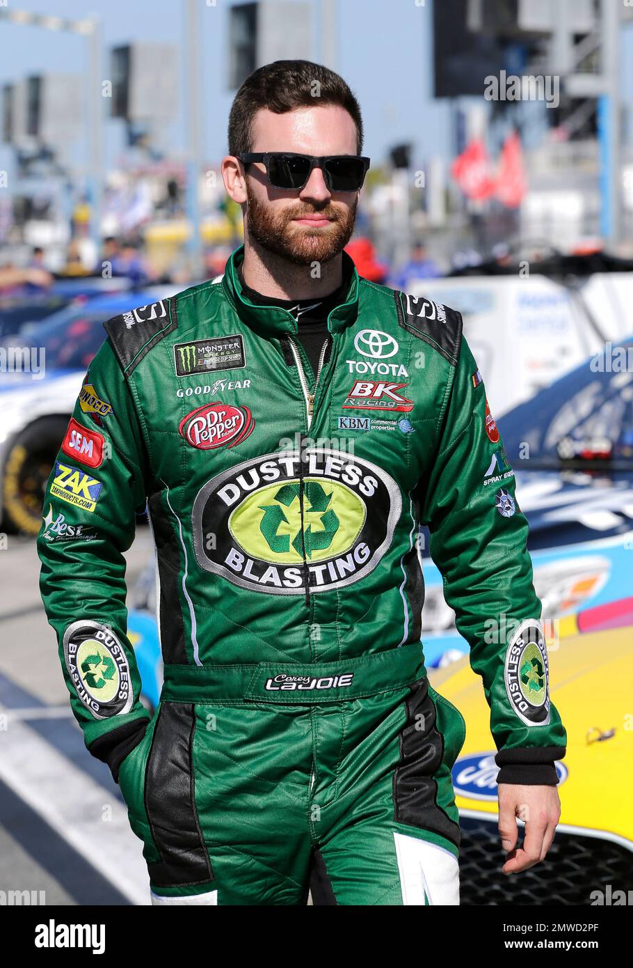 In this photo taken Feb. 19, 2017, Corey LaJoie walks on pit road ...