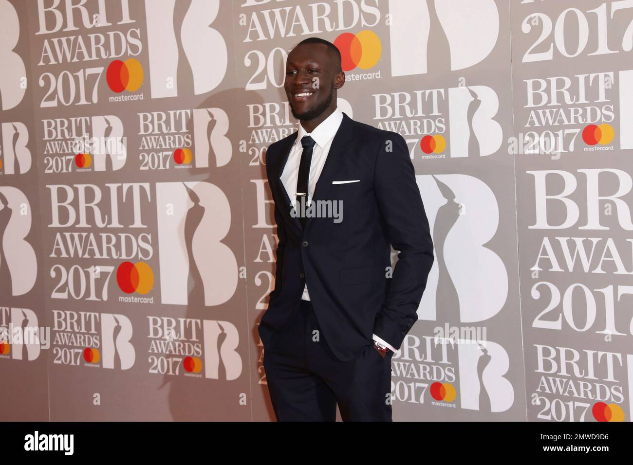 Musician Stormzy poses for photographers upon arrival at the Brit ...