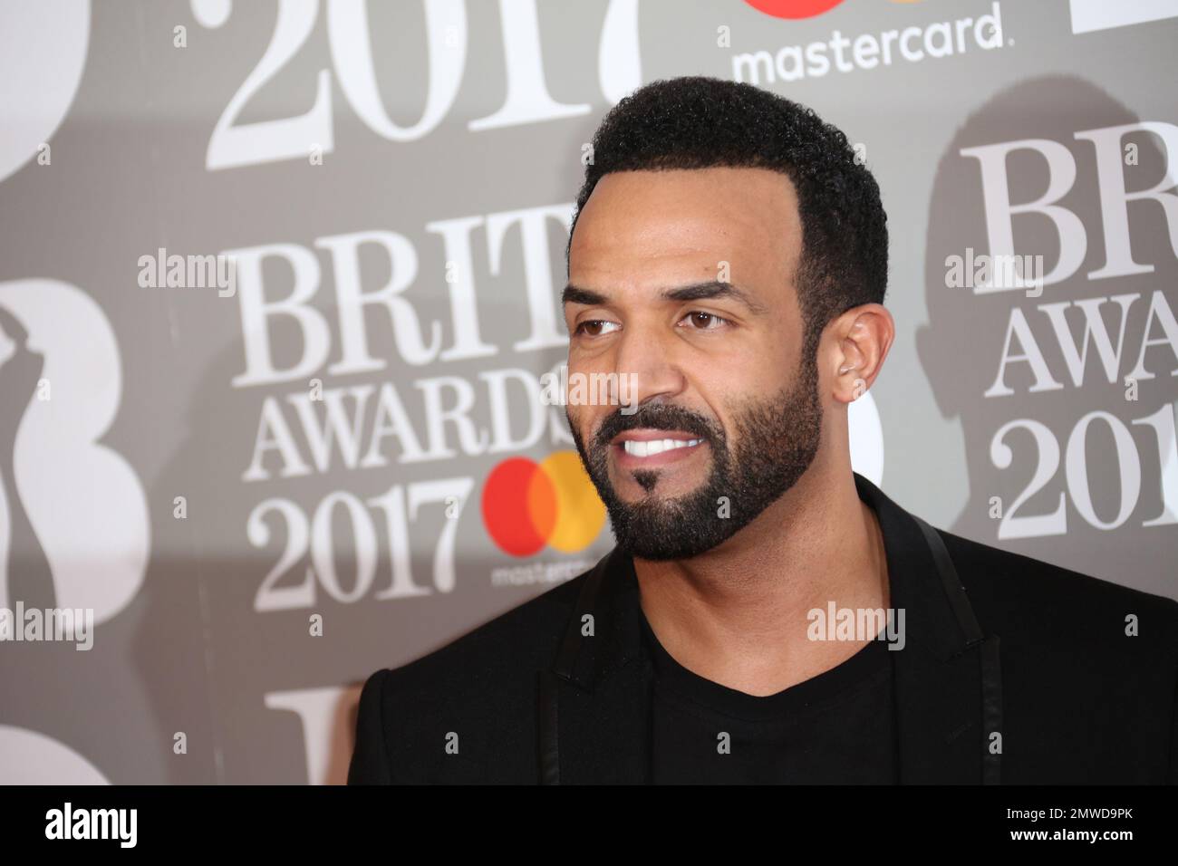 Singer Craig David poses for photographers upon arrival at the Brit ...