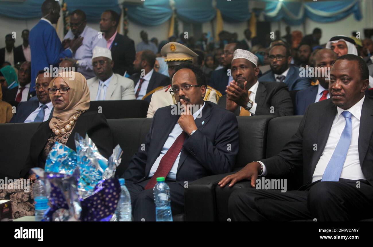 Somalia's President Mohamed Abdullahi Mohamed, also known as Farmajo, center, sits between his ...