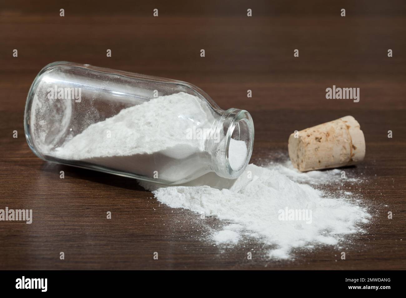 Baking soda - sodium bicarbonate in a glass jar on dark wooden ...