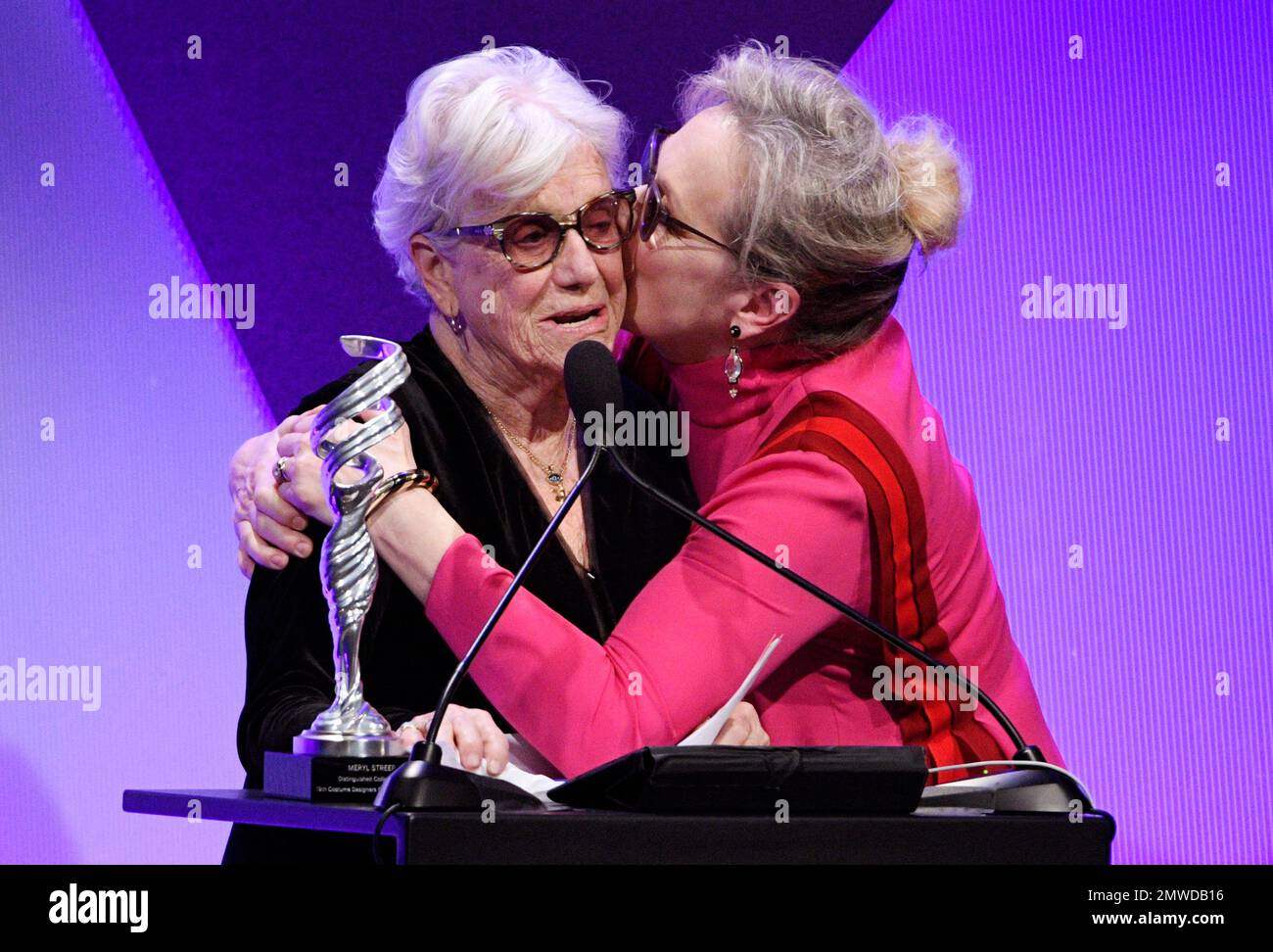 Presenter Ann Roth, left, gets a kiss from Meryl Streep after she gave ...