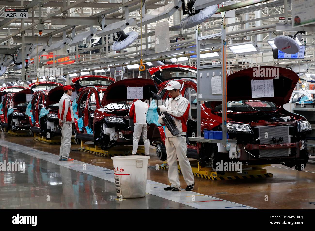 In this Sunday, Feb. 19, 2017 photo, workers assemble Haval SUV H2 ...
