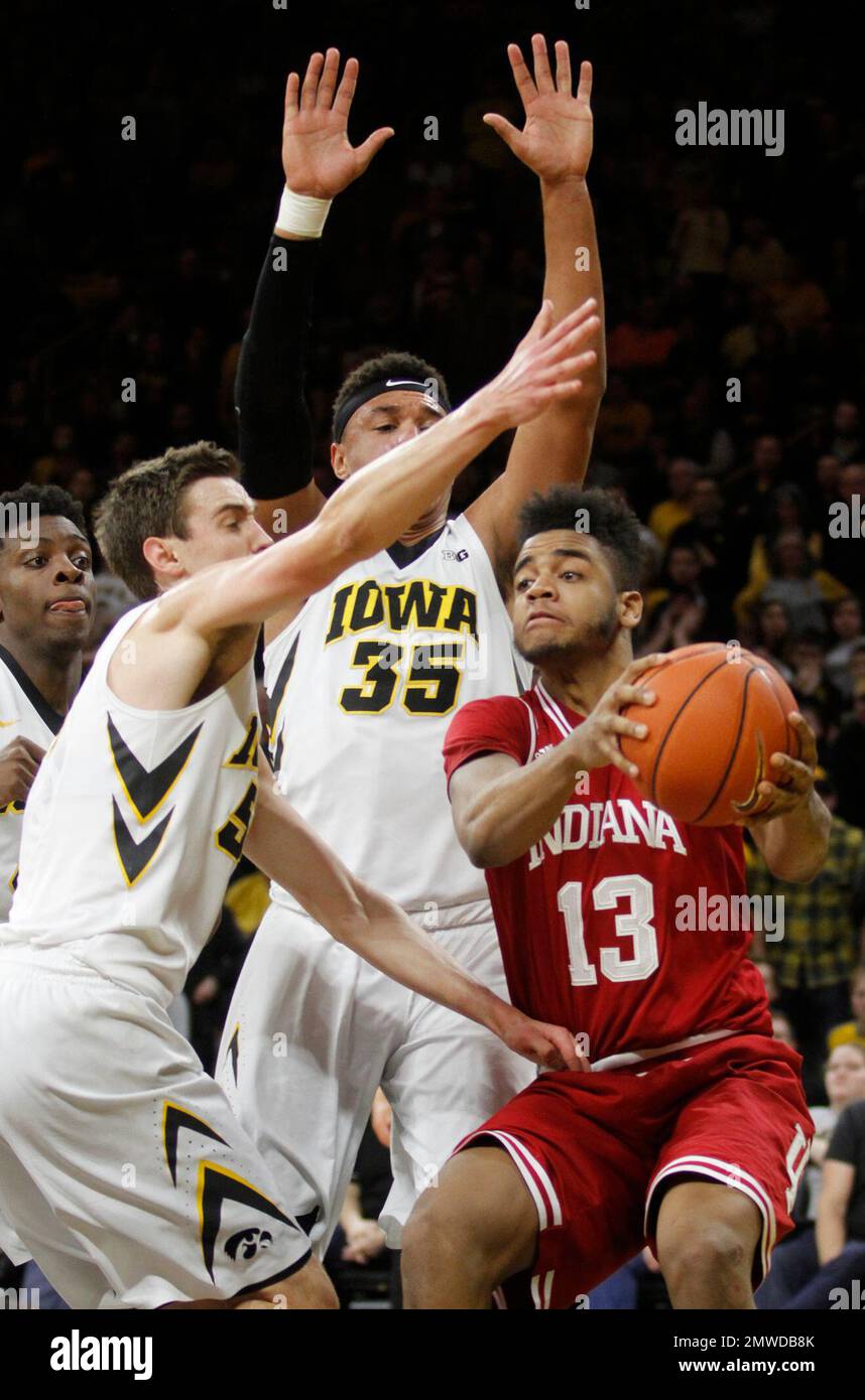 Indiana's Juwan Morgan (13) goes under the basket against Iowa's ...