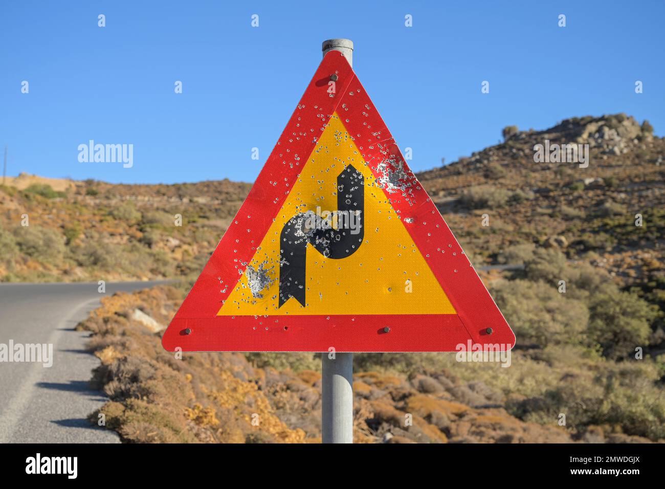 Shattered road sign, Crete Greece Stock Photo - Alamy