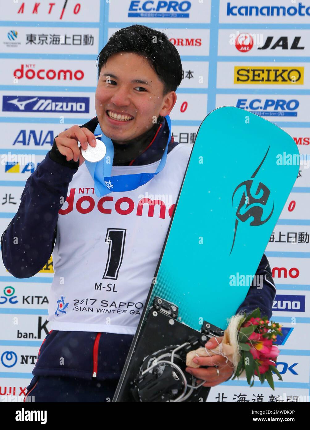 Silver medalist Yuya Suzuki of Japan poses with his medal on the podium at the men's snowboard ...
